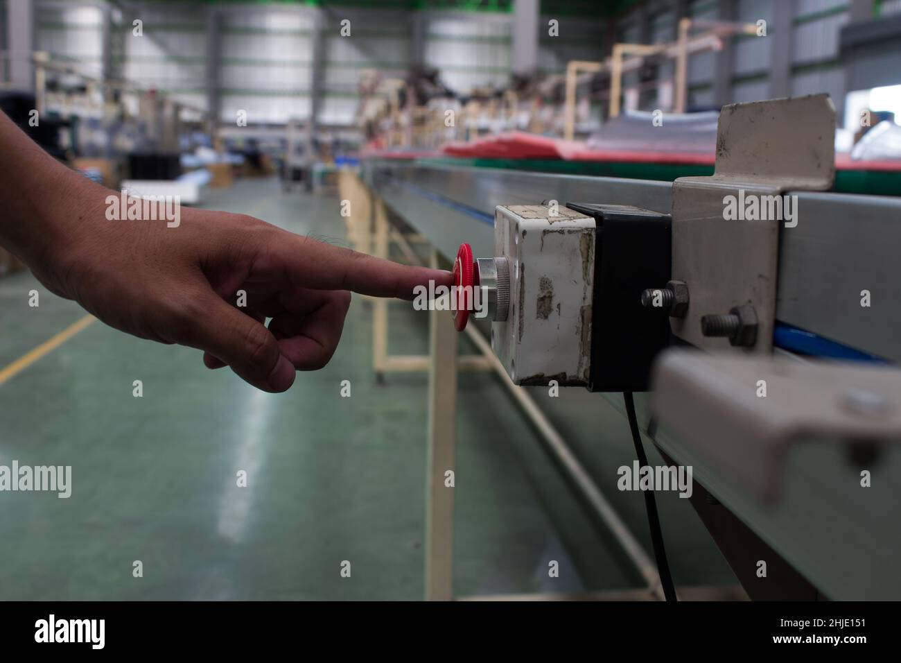 Male hand pushing emergency red stop button Stock Photo - Alamy