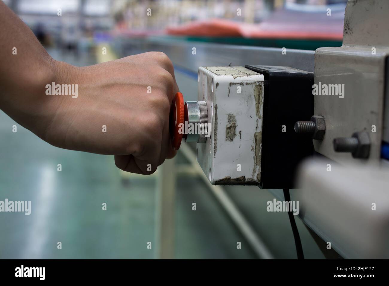 Male hand pushing emergency red stop button Stock Photo - Alamy