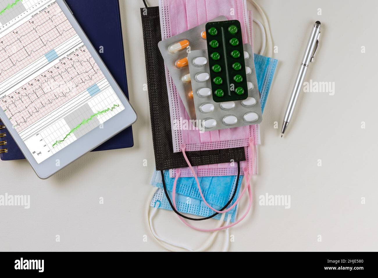 Workplace doctor with a cardiogram chart with medical table for heart ...
