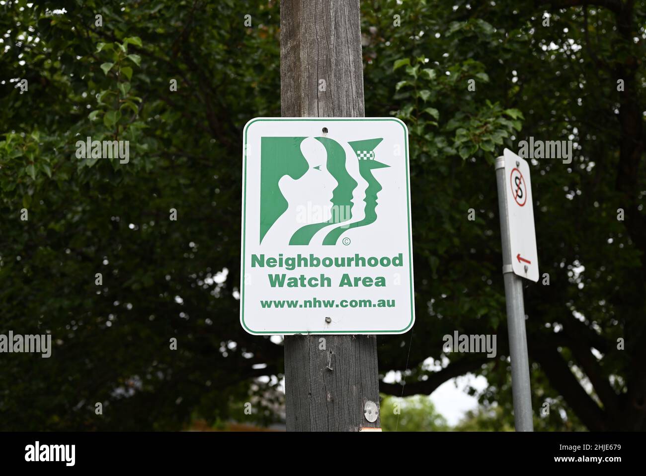 Neighbourhood Watch Area sign attached to a power pole in a suburban ...