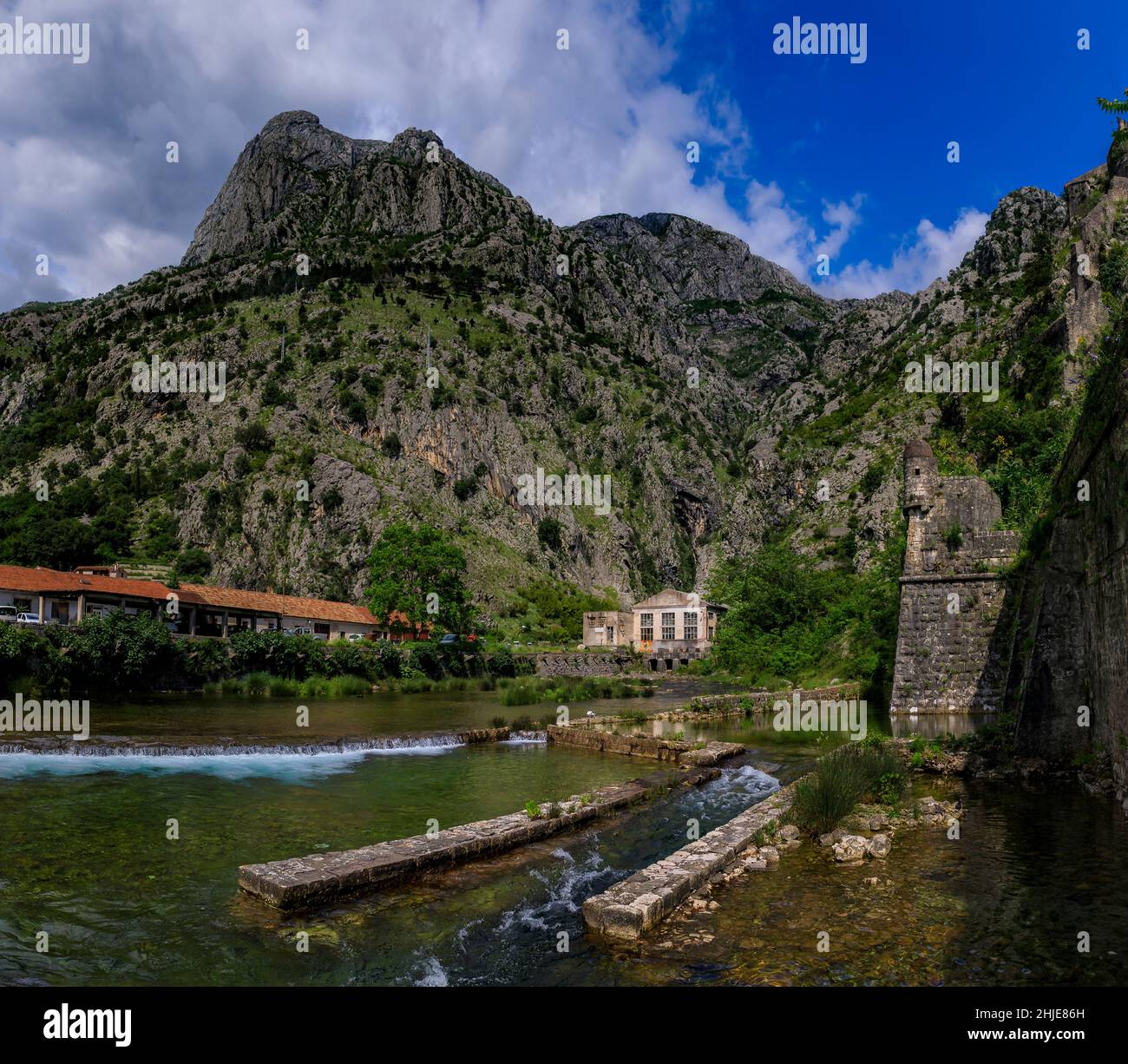 Emerald green waters of Kotor Bay or Boka Kotorska, mountains and the ...