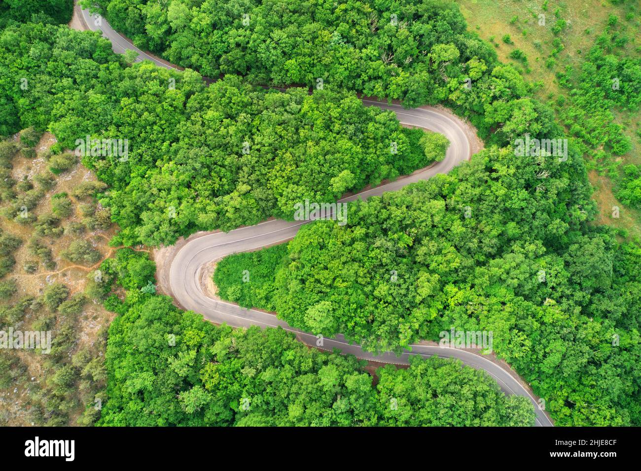 Road serpentine in mountain. Aerial nature scene Stock Photo - Alamy