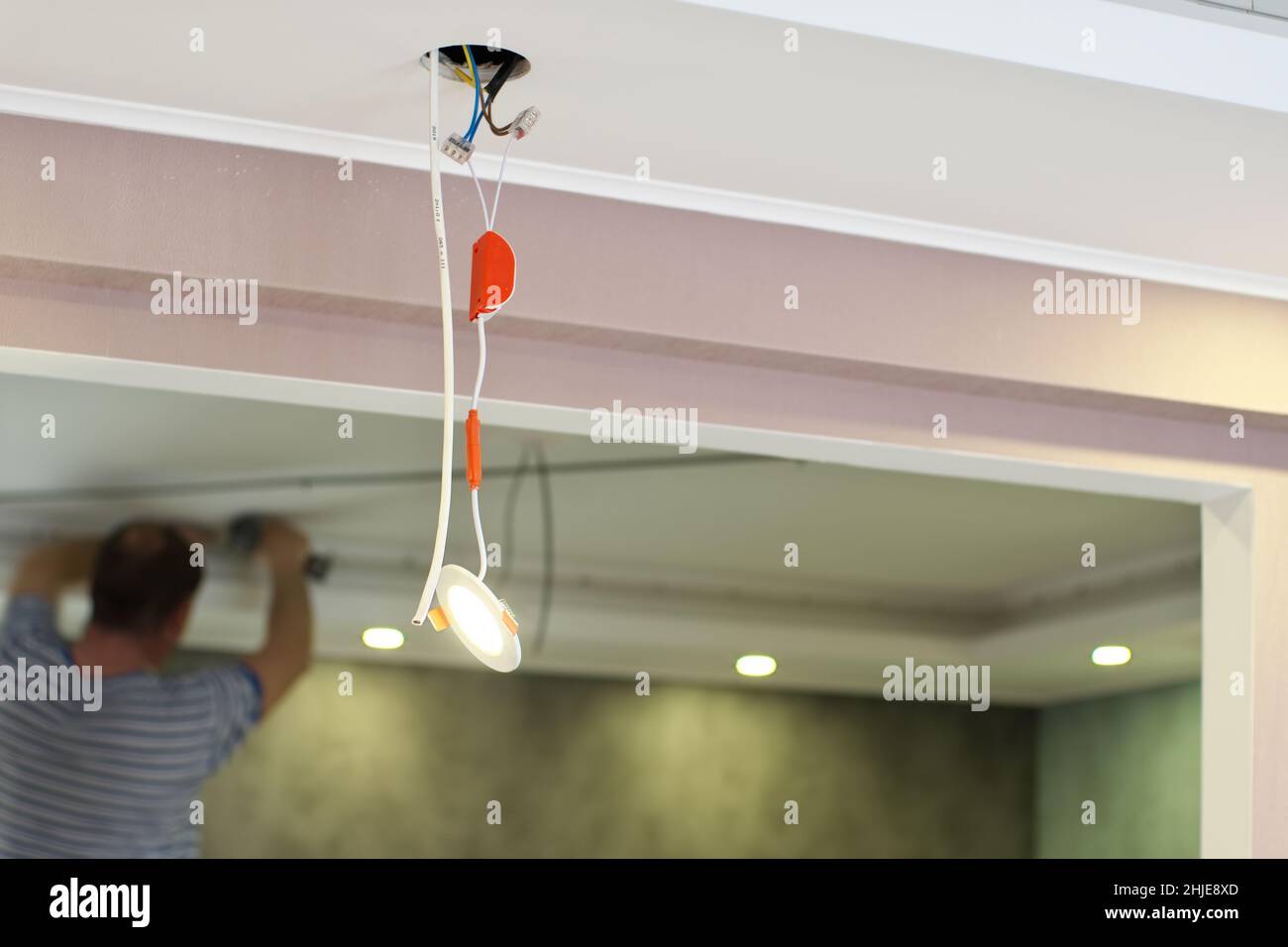 Repair of ceiling lamp. Working scene Stock Photo - Alamy