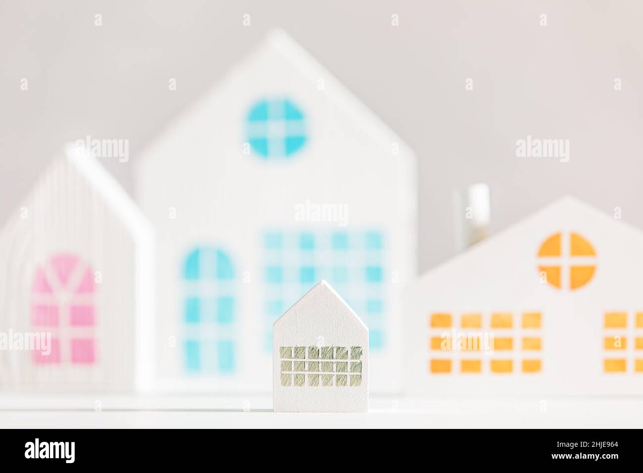 Little white house model among a small town or suburb Stock Photo - Alamy