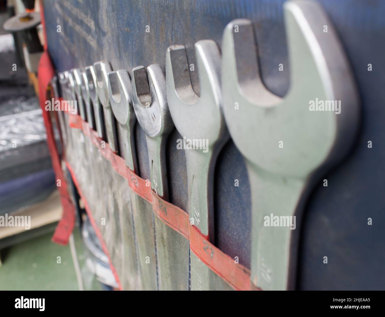 Set of wrenches isolated on blue background Stock Photo - Alamy