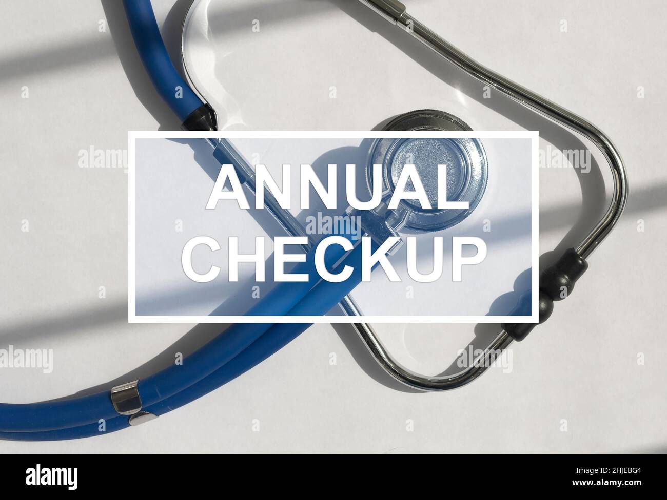 Annual checkup text on photo with sthethoscope. Health and medic care ...