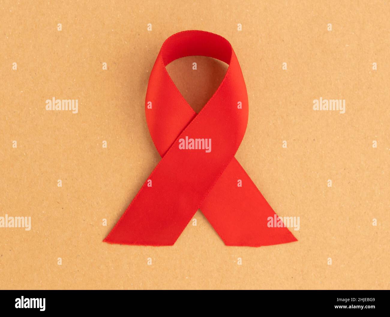 Red satin ribbon ith loop as symbol of HIV and AIDS awareness day in ...