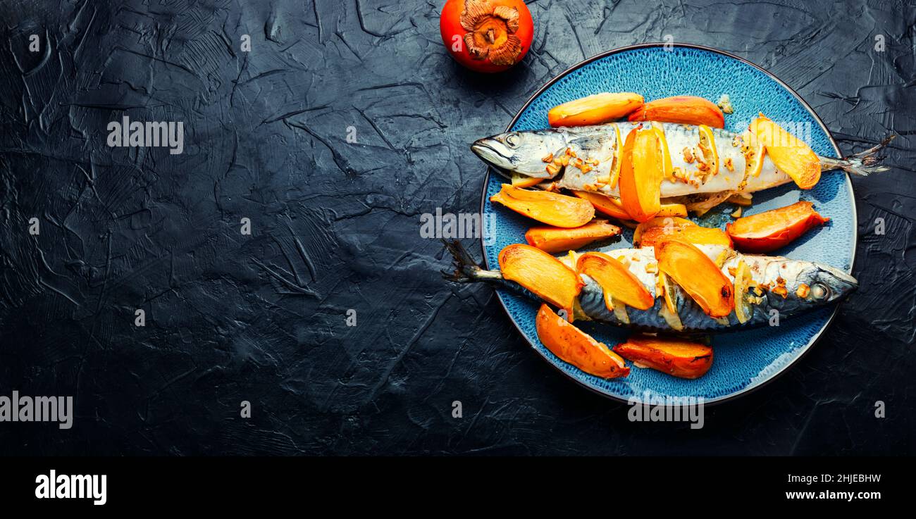 Lunch, mackerel fish baked with persimmon and lemon. Copy space, menu ...