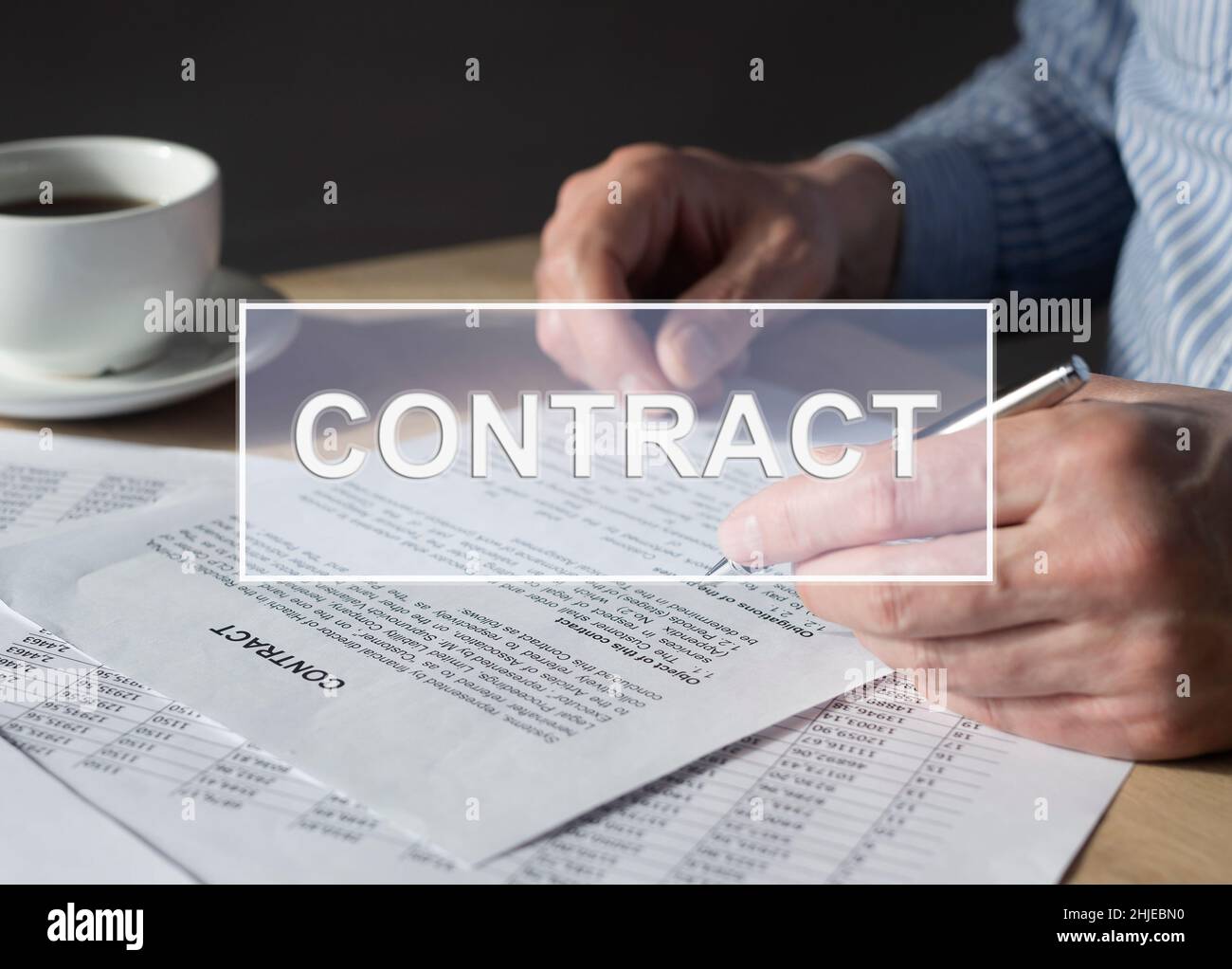 Word contract over photo of hands and agreement Stock Photo - Alamy