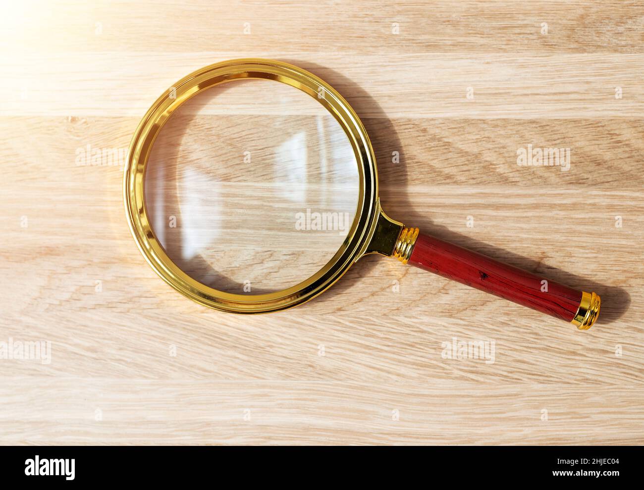 Magnifying glass golden gold hi-res stock photography and images - Alamy