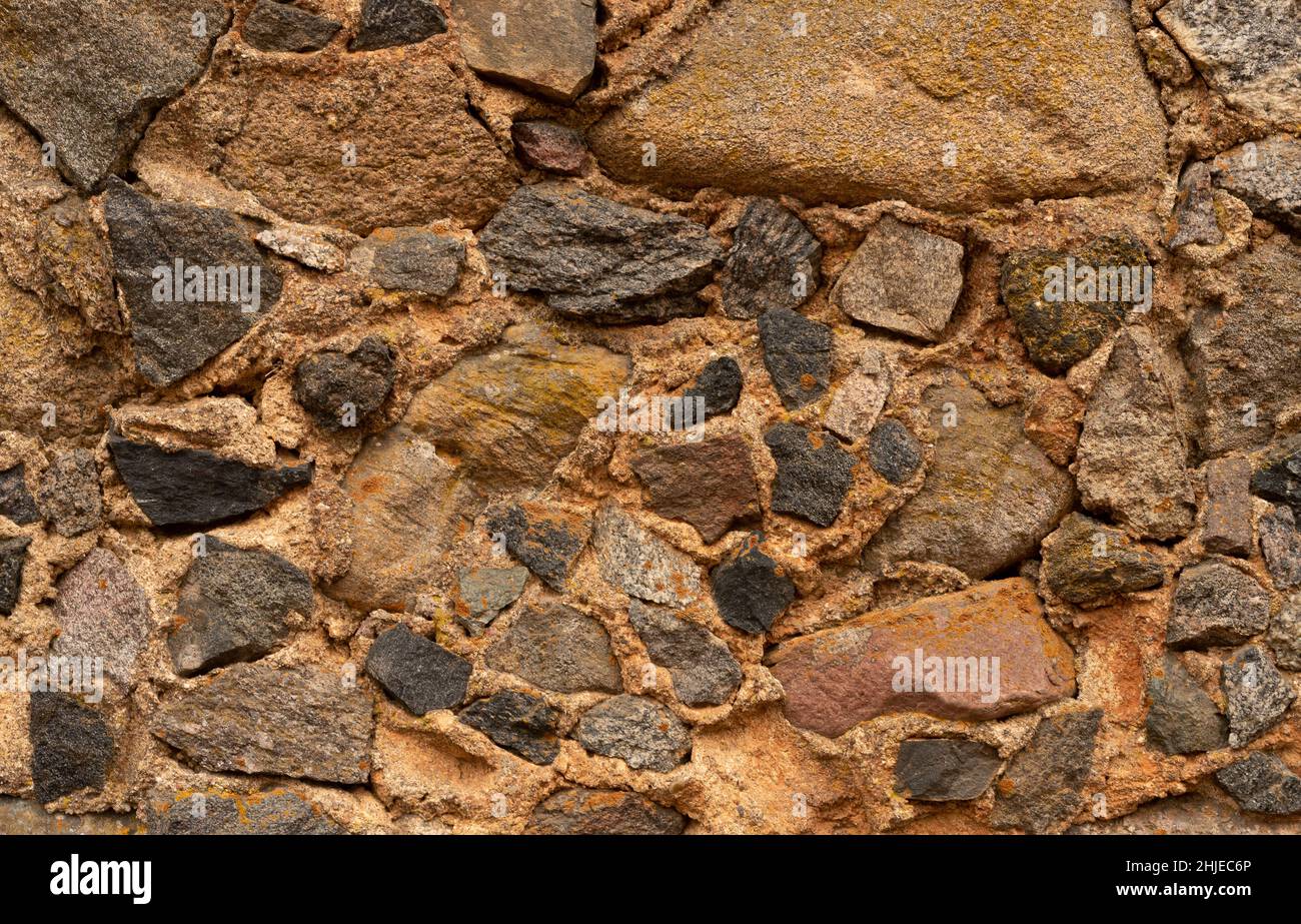 Retro rocky stone wall background. Vintage rock texture Stock Photo - Alamy