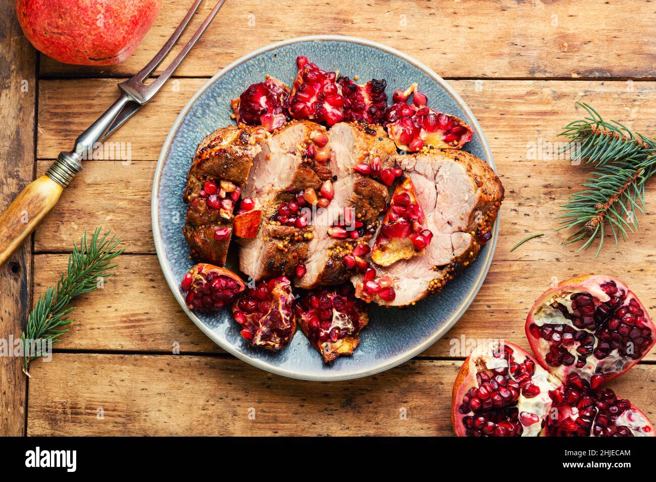 Delicious piece of meat fried with pomegranate Stock Photo - Alamy