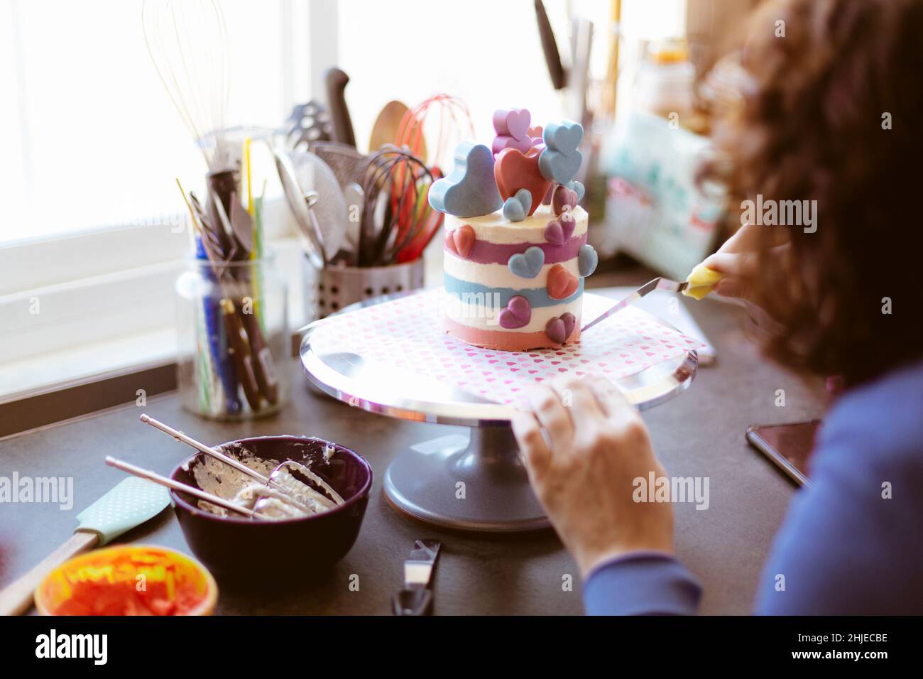 Unrecognizable woman pastry chef decorating hi-res stock photography ...