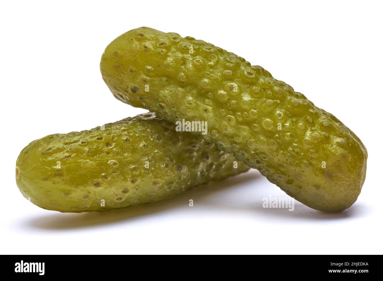 Tasty Whole green cornichon isolated on a white background Stock Photo ...