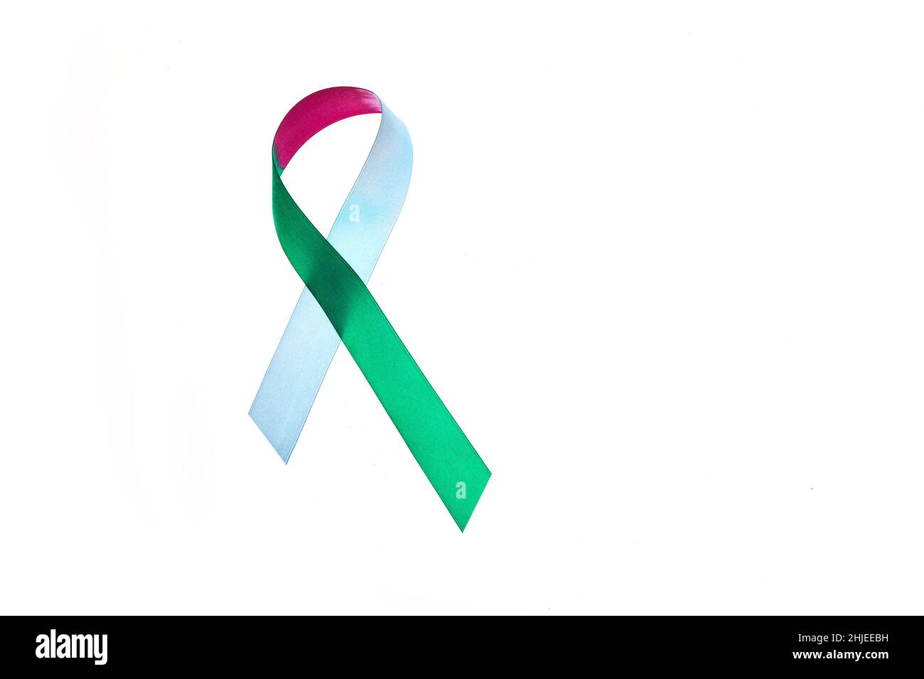 Three-color ribbon for the World rare disease day on white background ...