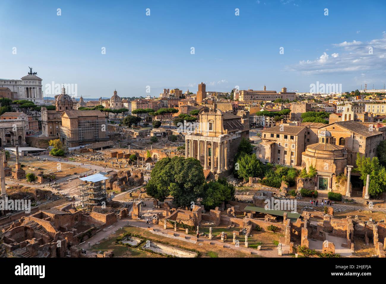 Ancient ruins of the Roman Forum at sunset in city of Rome in Italy ...