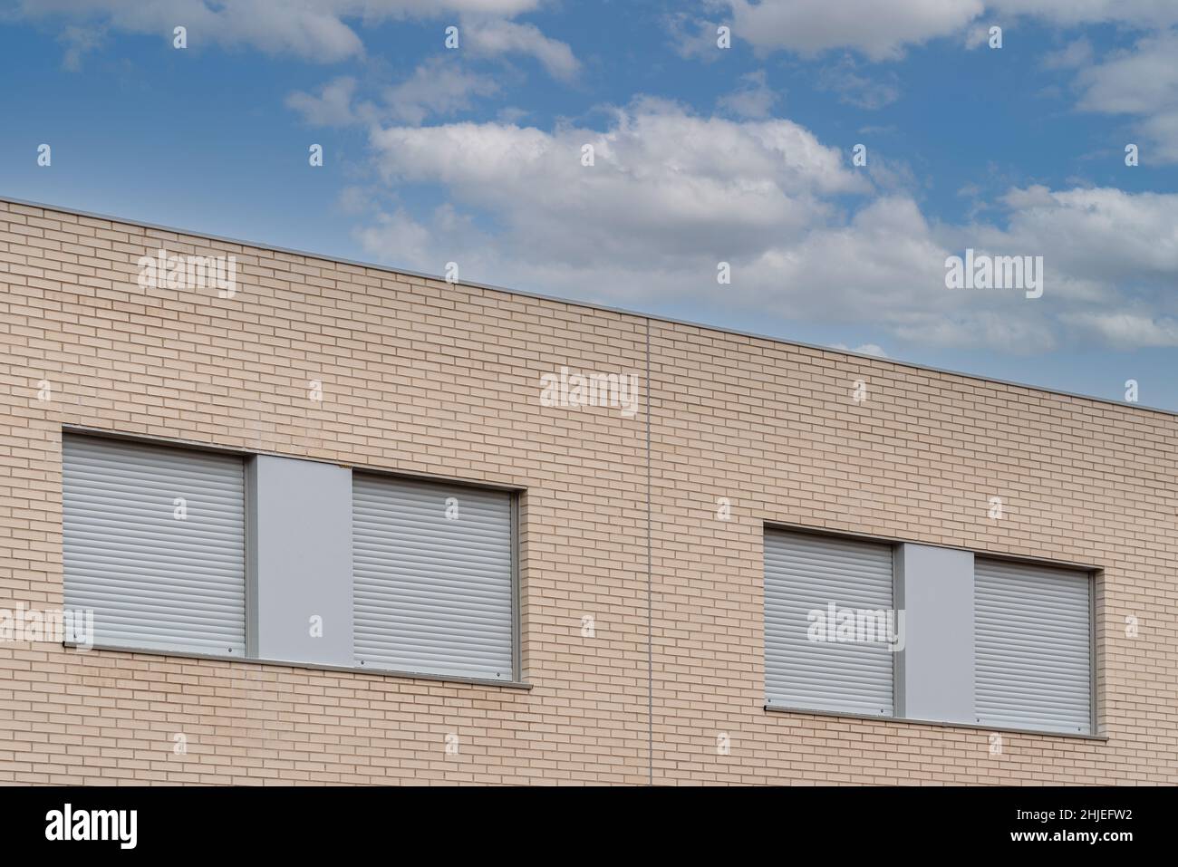 Detail of window of contemporary row houses with brick facade ...