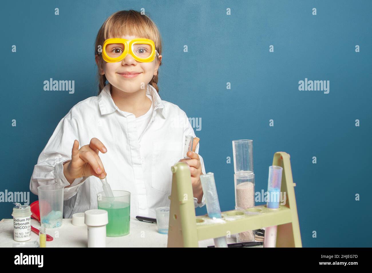 Happy child girl doing science experiments. Science and education ...