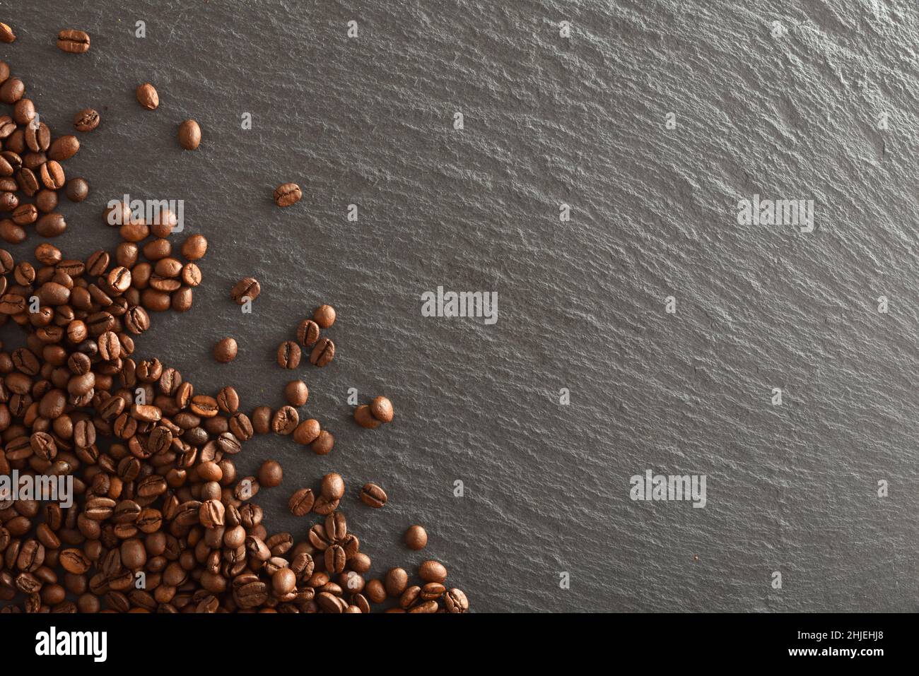 Dark background with heap of selected natural coffee beans in one ...