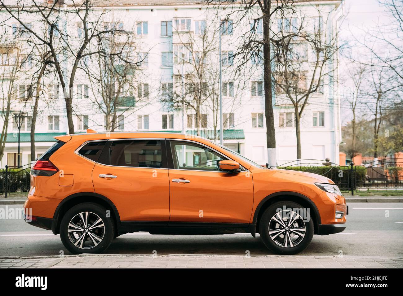 Orange Nissan X-Trail third generation Car Parked At Street. Side View ...