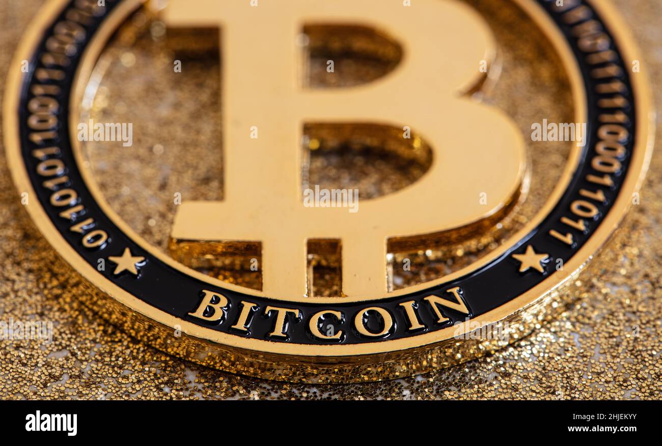 bitcoin on golden background for design purpose Stock Photo - Alamy