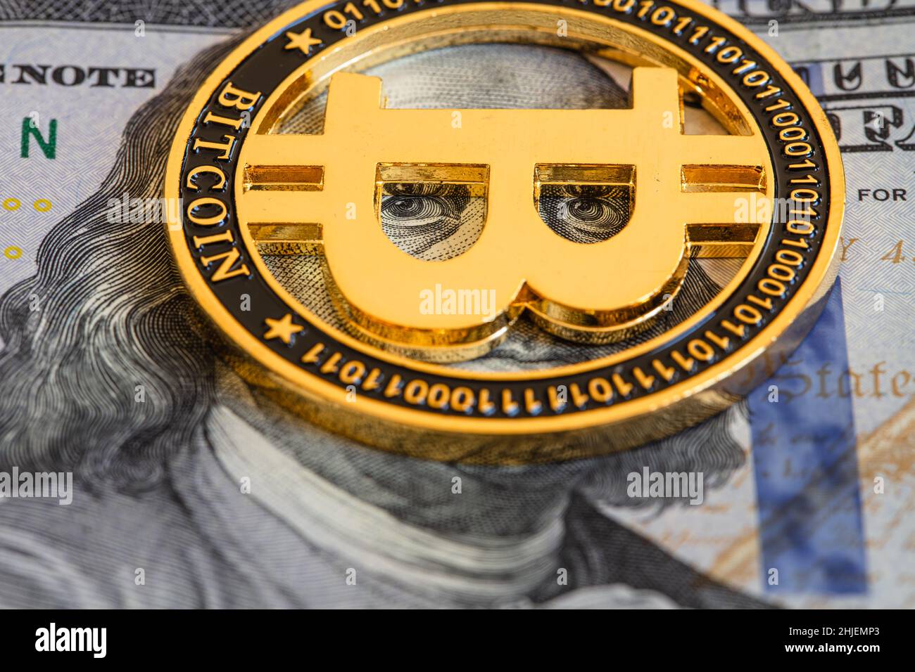 Bitcoin on 100 dollar bill background for design purpose Stock Photo ...