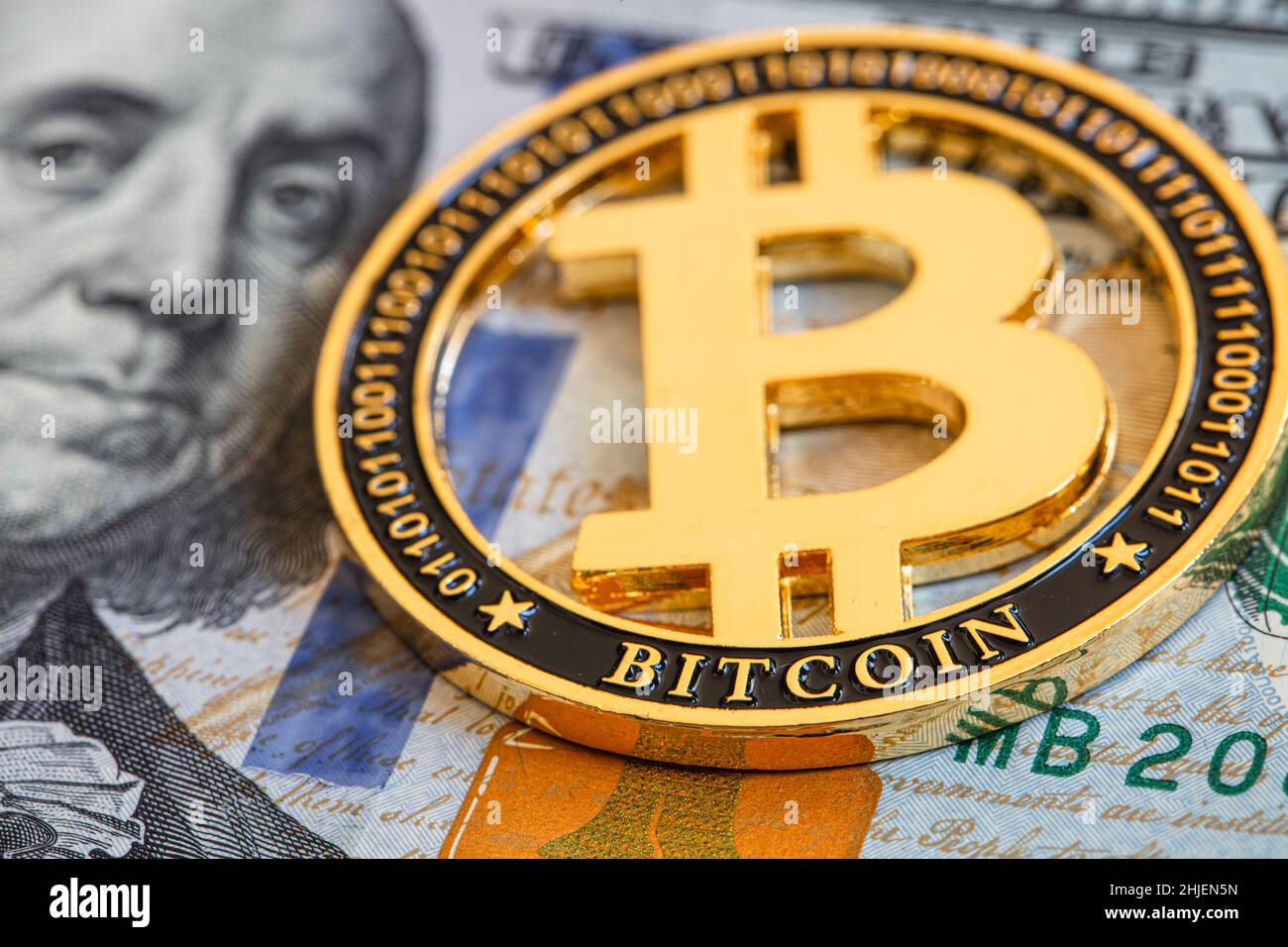 Bitcoin on 100 dollar bill background for design purpose Stock Photo ...