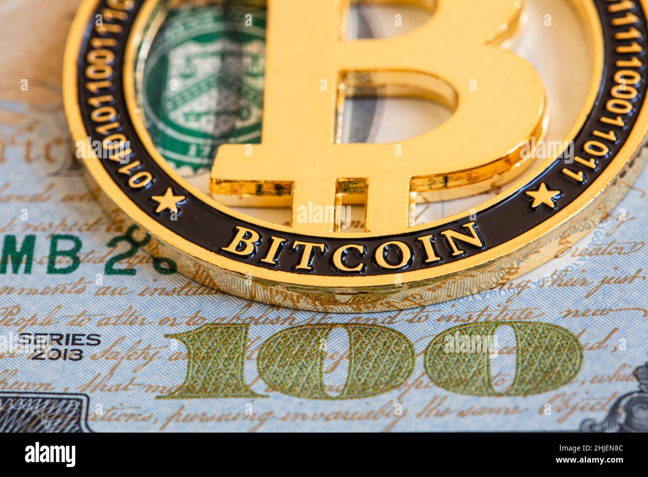 Bitcoin on 100 dollar bill background for design purpose Stock Photo ...
