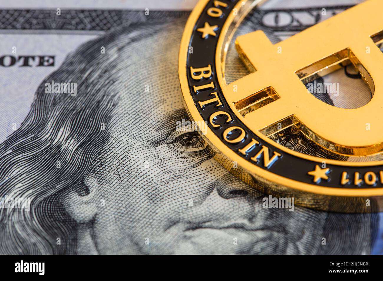 Bitcoin on 100 dollar bill background for design purpose Stock Photo ...