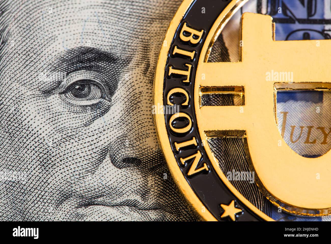 Bitcoin on 100 dollar bill background for design purpose Stock Photo ...