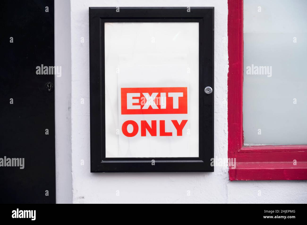 Exit only sign at pub and bar restaurant on wall Stock Photo - Alamy