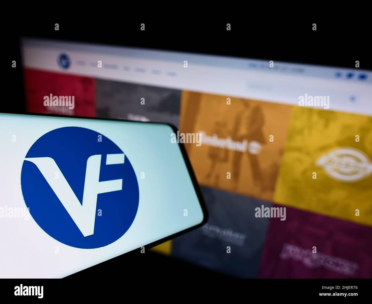 Mobile phone with logo of US apparel company VF Corporation on screen ...