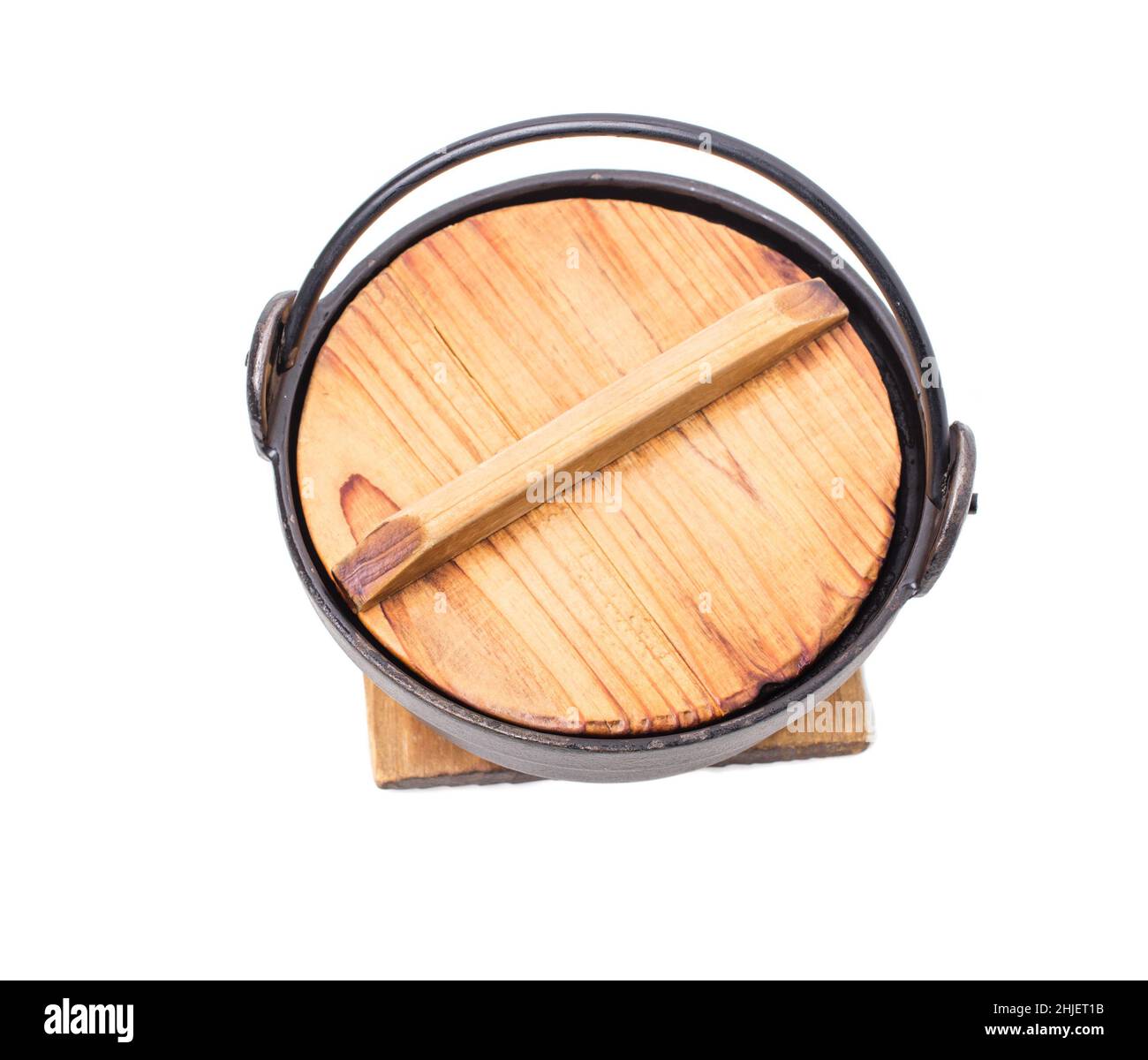 Old kitchen metal pot with wooden cap. Isolated on a white background ...