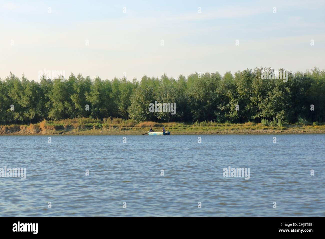 Danube Delta landscape with a fishing boat in Romania Stock Photo - Alamy