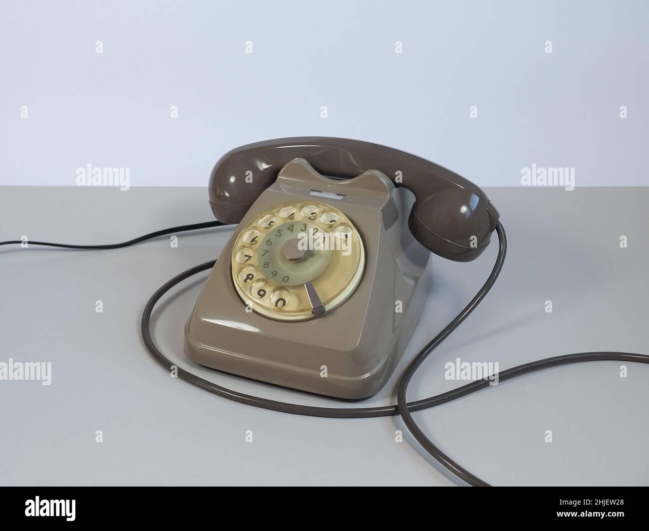 Vintage grey rotary dial analog landline telephone Stock Photo - Alamy