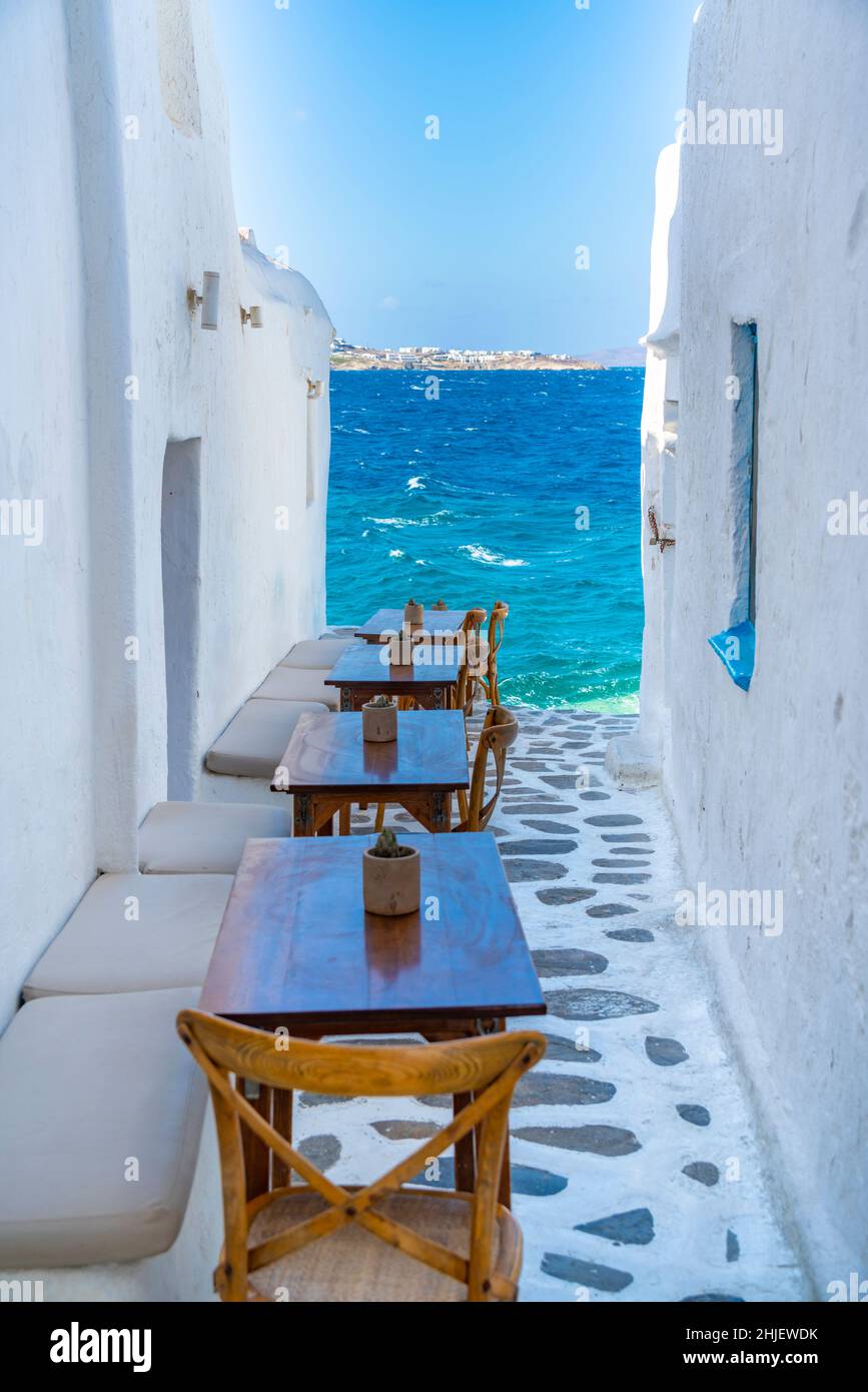 View of sea and restaurant tables in Mykonos Town, Mykonos, Cyclades ...