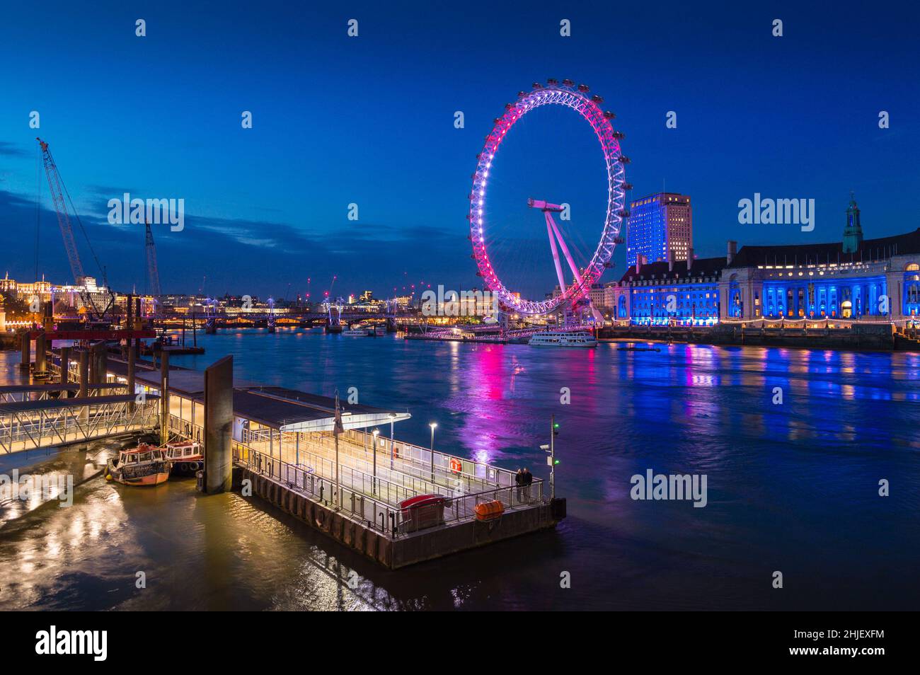 Blue hour on river Thames with modern buildings and attractions, London ...