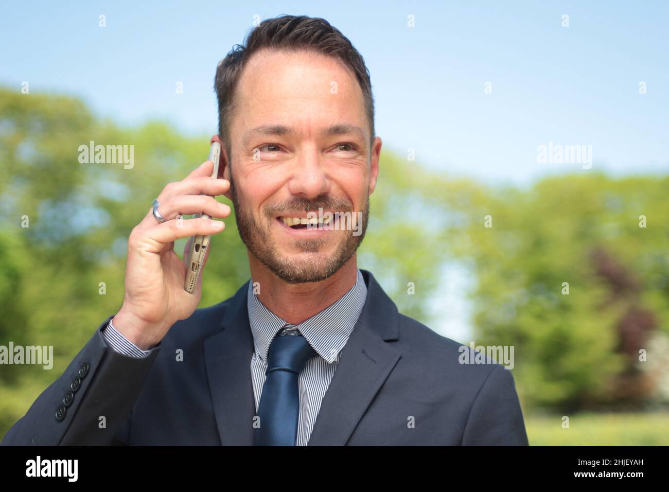 Beautiful commercial man outside Stock Photo - Alamy