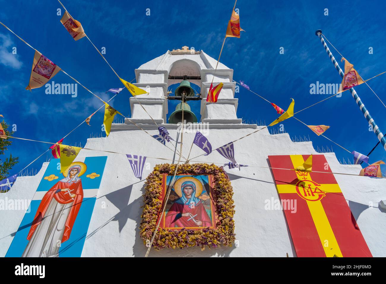 View of chapel and colourful flags, Mykonos Town, Mykonos, Cyclades ...