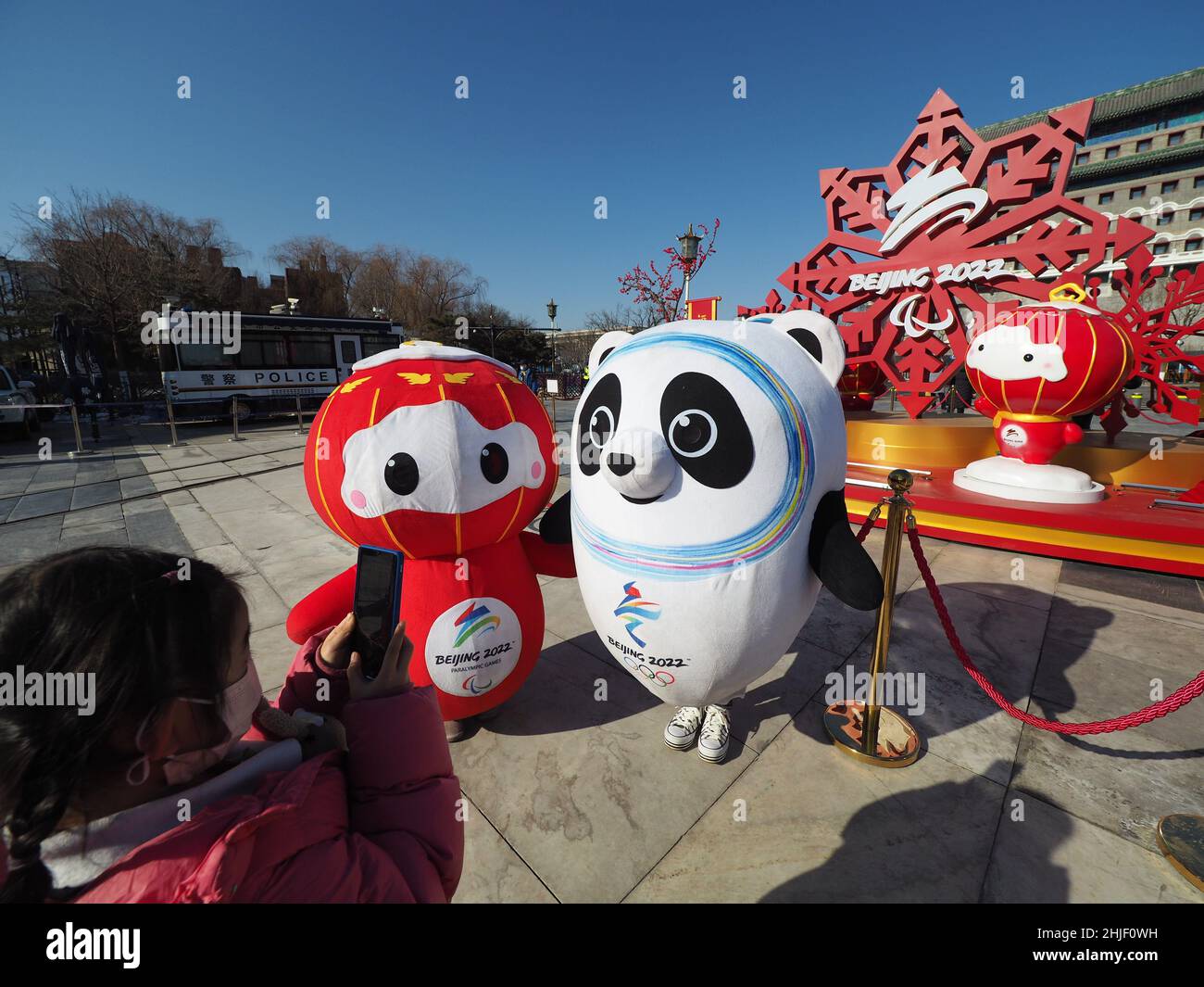 BEIJING, CHINA - JANUARY 29, 2022 - Tourists look at cartoon figures of ...