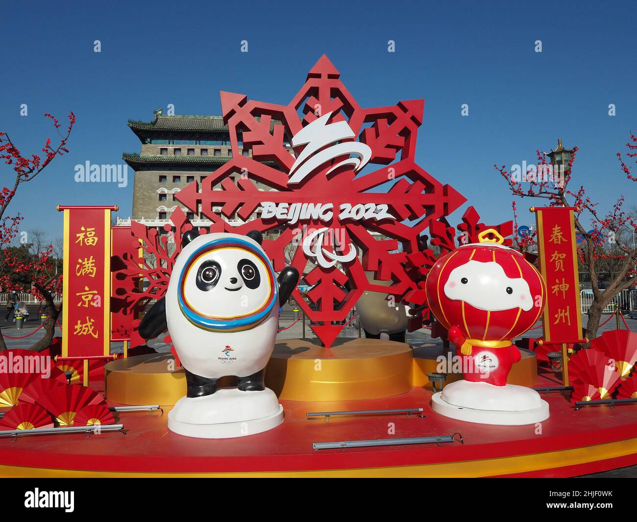 BEIJING, CHINA - JANUARY 29, 2022 - Tourists look at cartoon figures of ...