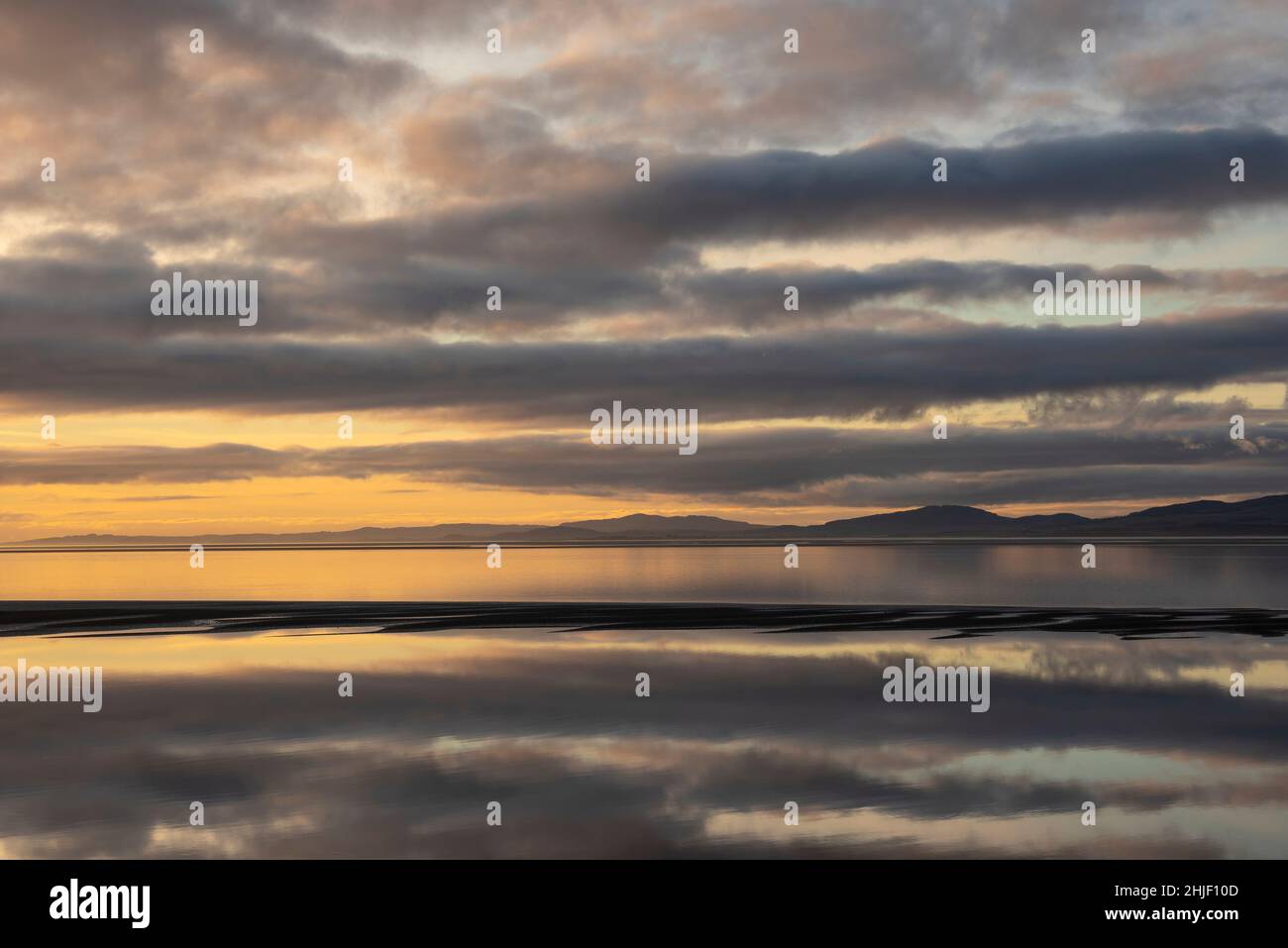 Epic sunset landscape image of Solway Firth viewed from Silloth during ...