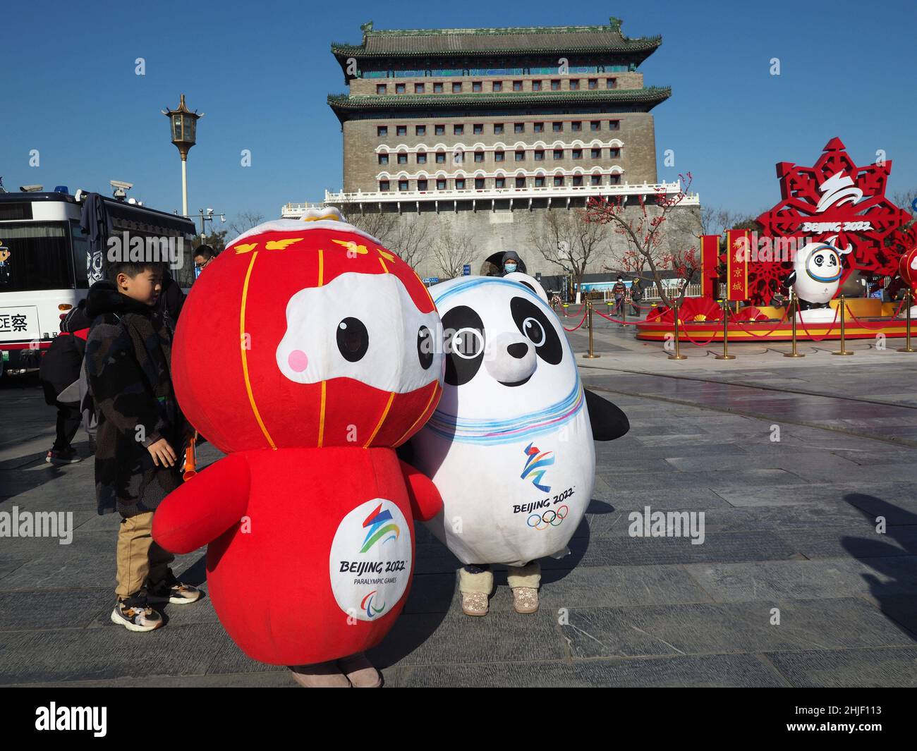 BEIJING, CHINA - JANUARY 29, 2022 - Tourists look at cartoon figures of ...
