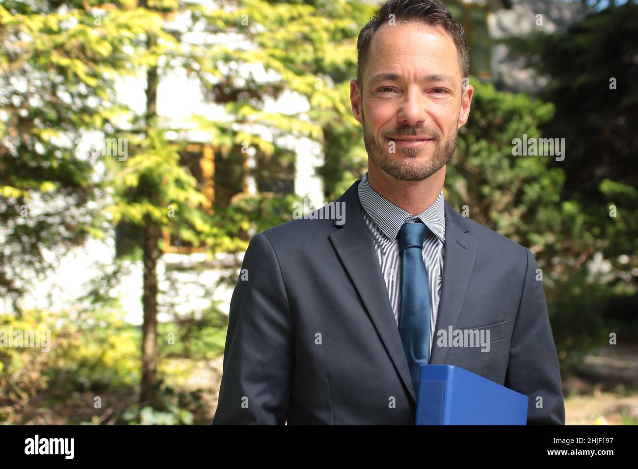 Beautiful commercial man outside Stock Photo - Alamy