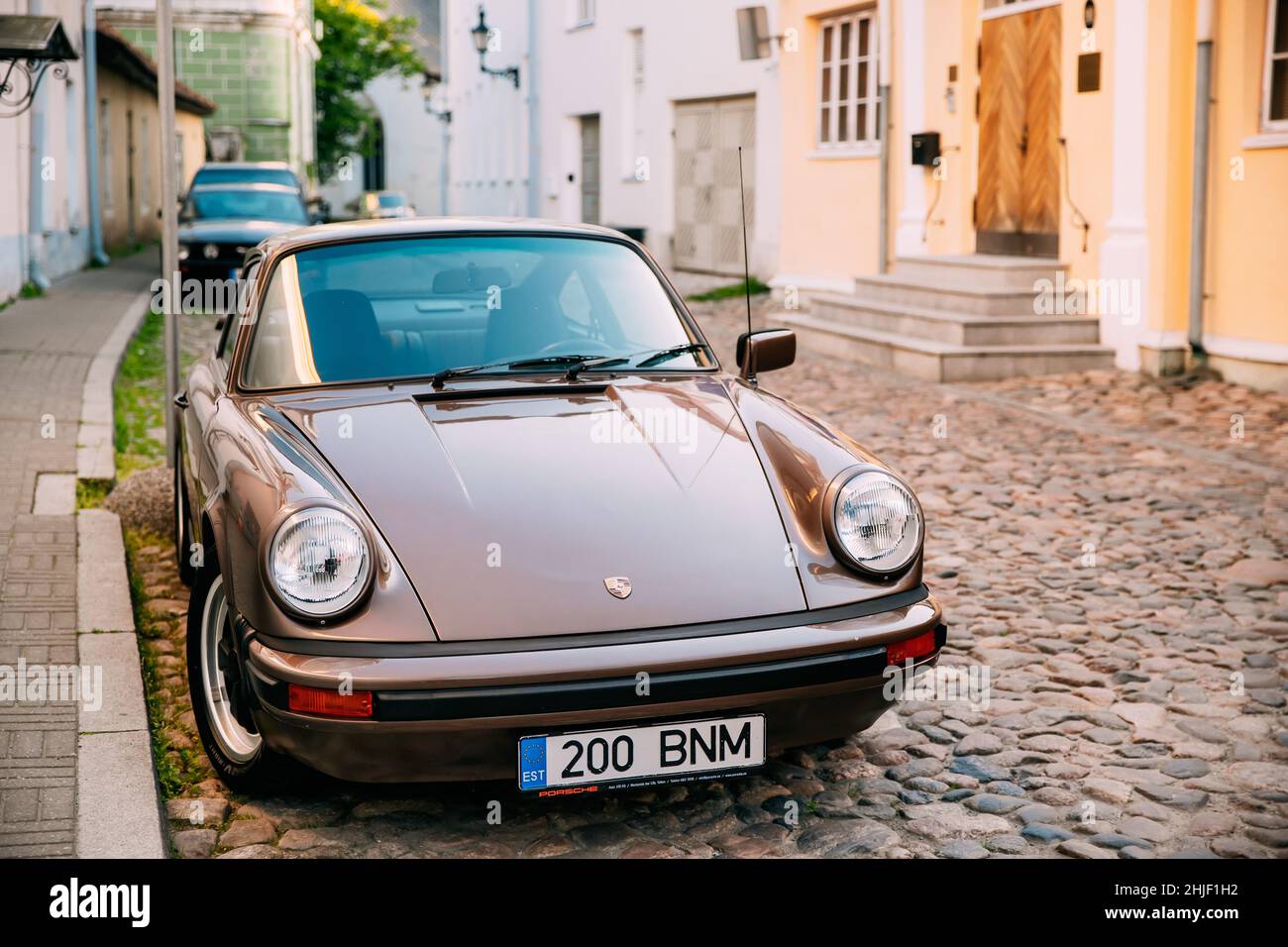 Front View Of Porsche 930 Car Parked In Old Narrow Street Stock Photo ...