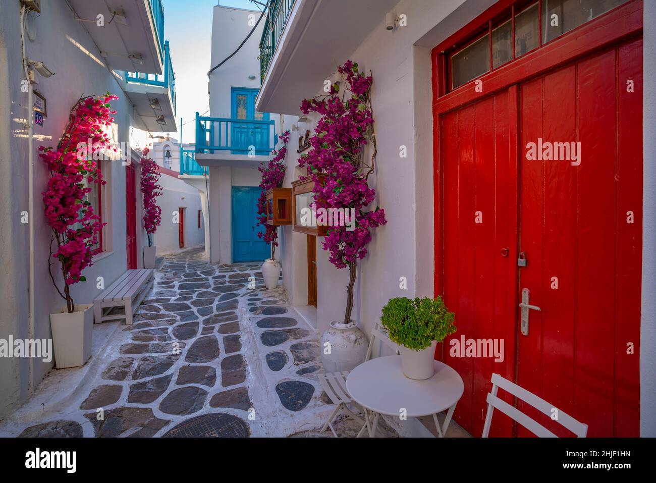 View of colourful narrow cobbled street, Mykonos Town, Mykonos, Cyclades Islands, Greek Islands ...