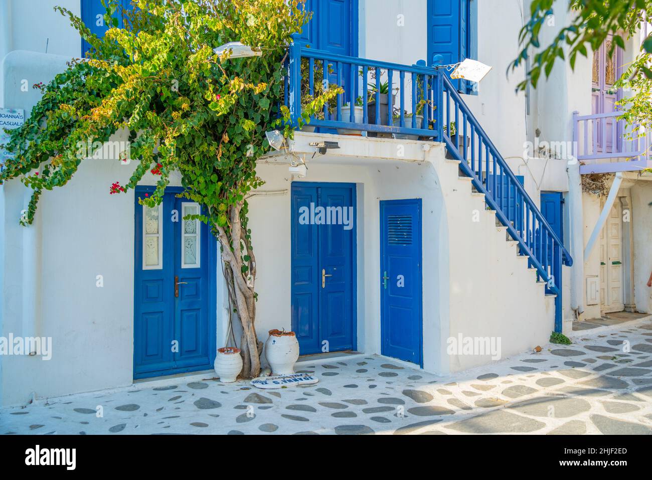 View of traditional white washed and blue house, Mykonos Town, Mykonos ...