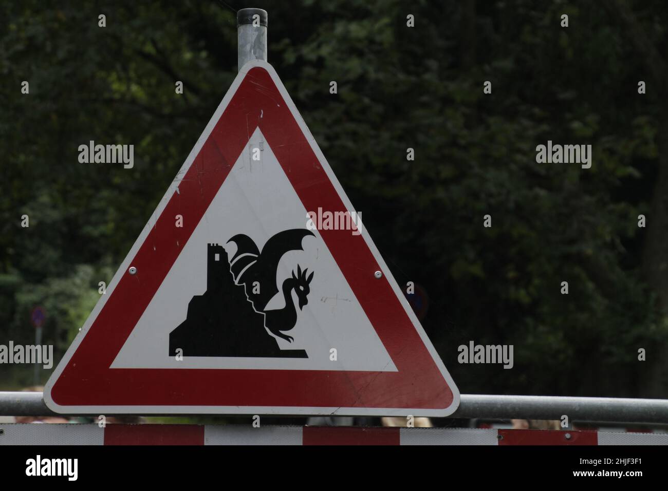 Closeup of a warning sign - beware of dragons Stock Photo - Alamy