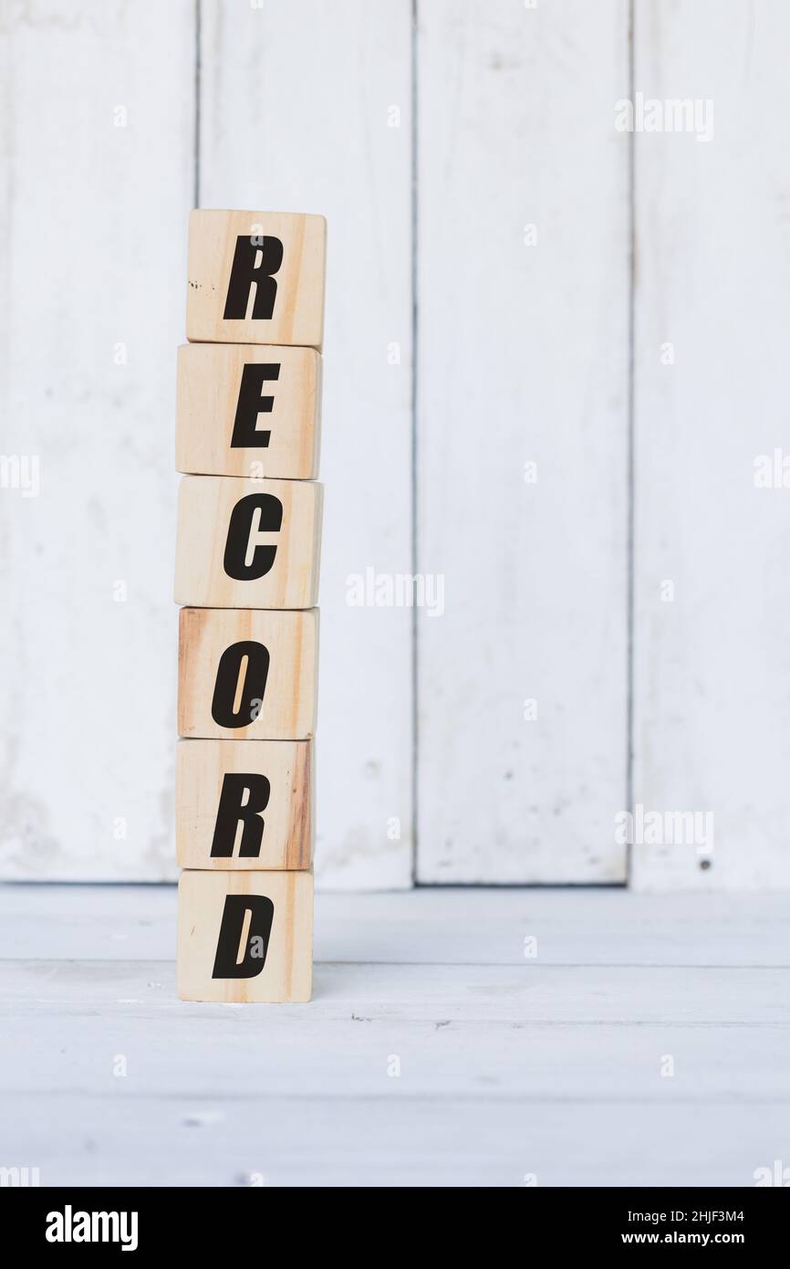 wooden cube, with the word record, with white wooden background Stock ...