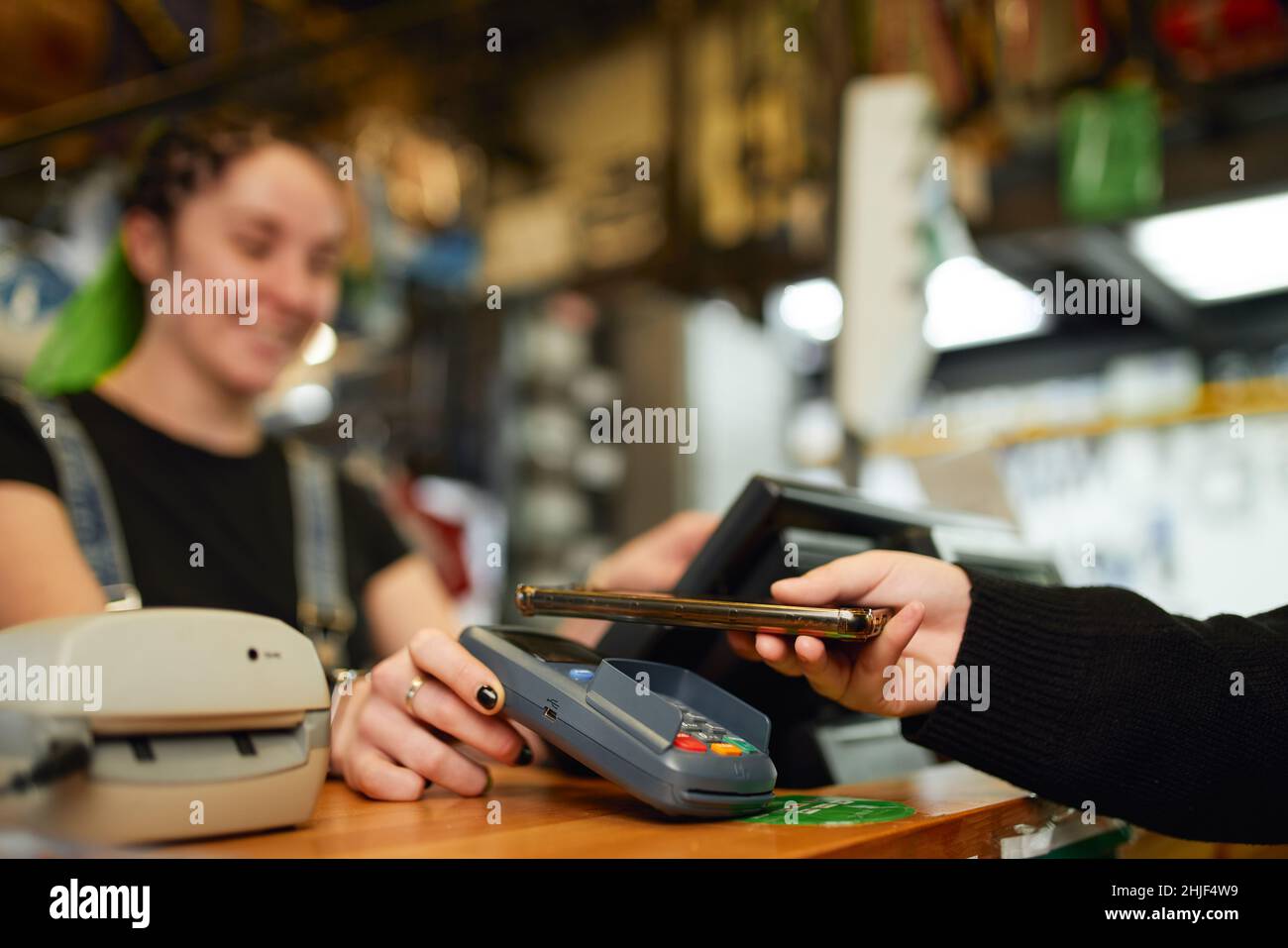 Shopper using contactless payment hi-res stock photography and images ...